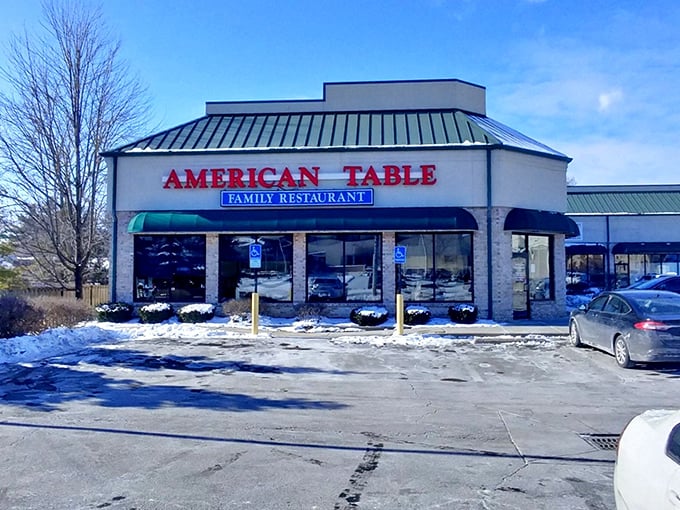 The beacon of breakfast bliss with its unmistakable green awnings and bright red signage announces itself to hungry travelers like a culinary lighthouse.