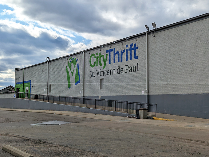 The unassuming exterior of St. Vincent de Paul Thrift Store in Dayton – where treasure hunting begins and wallets breathe sighs of relief.