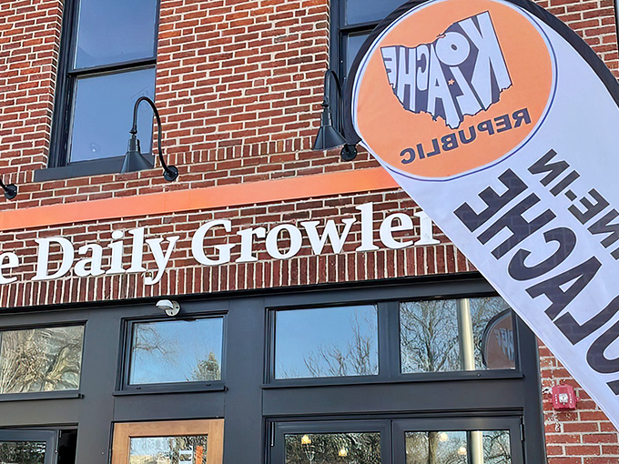 Kolache Republic's vibrant orange sign beckons from the brick facade of The Daily Growler building, like a delicious secret hiding in plain sight.