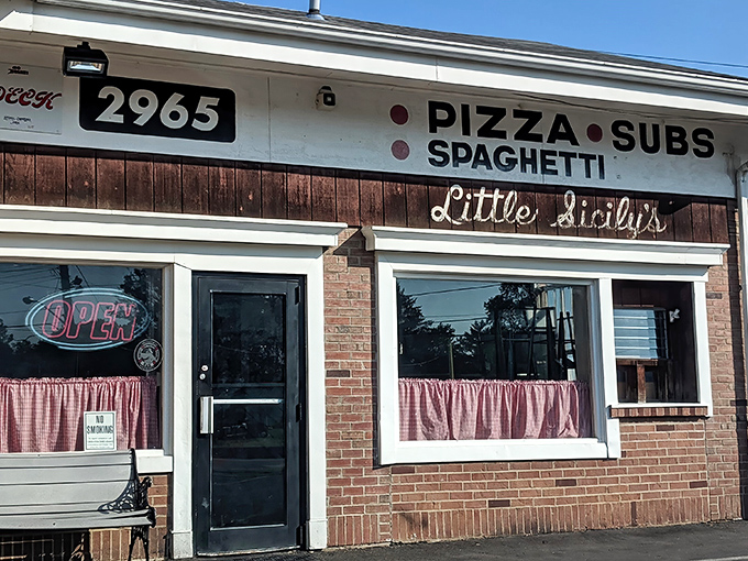 The unassuming brick façade of Little Sicily's might not stop traffic, but locals know this modest storefront houses pizza treasures worth slamming on the brakes for.