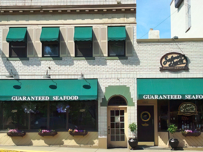The distinctive navy blue awning signals your arrival at coastal paradise, even in landlocked Ohio. Those flower baskets aren't just pretty—they're your first hint of the attention to detail waiting inside.