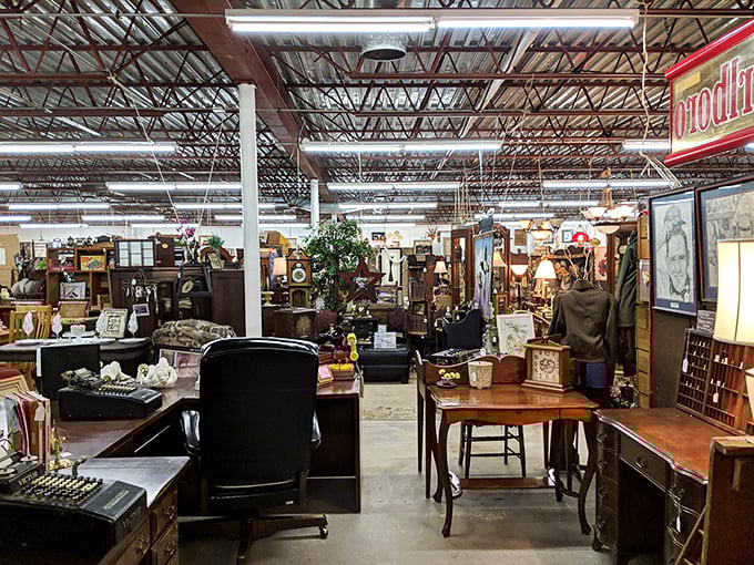 A treasure hunter's dream come true! Vintage cabinets, blue ottomans, and carefully arranged vignettes create the thrill of discovery around every corner.