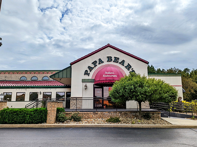 The welcoming facade of Papa Bear's Italian Restaurant in North Canton beckons with its distinctive burgundy awning and stone accents—like a warm Italian hug in building form.