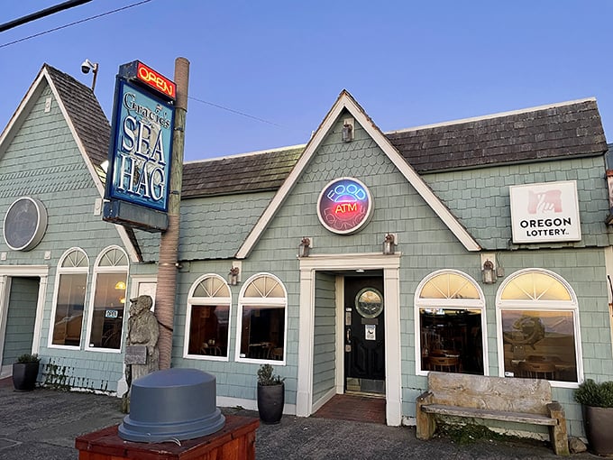 The seafoam green exterior of Gracie's Sea Hag stands like a coastal sentinel, promising seafood treasures within its unassuming walls.