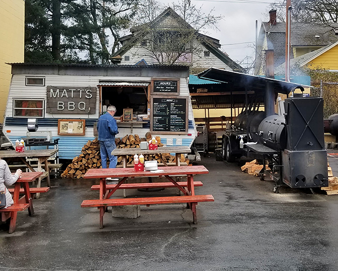 The humble blue trailer that launched a thousand BBQ pilgrimages. Matt's BBQ proves greatness doesn't require fancy digs—just wood, smoke, and patience.