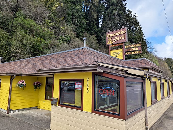 The sunshine-yellow exterior of Pancake Mill stands out like a beacon of breakfast hope on Oregon's coast, promising carb-laden comfort to weary travelers.