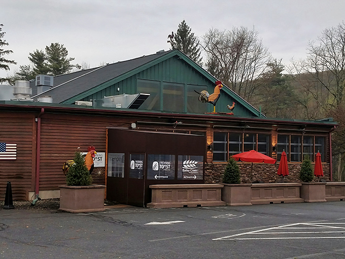 The rustic charm of Barley Creek's exterior, complete with that whimsical rooster weathervane, promises Pocono Mountain magic before you even step inside.