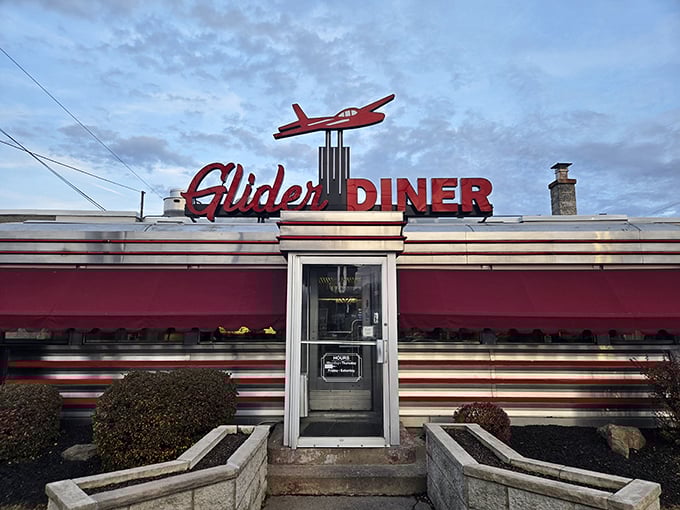 The iconic red glider plane perched atop this classic Scranton diner isn't just decoration—it's a beacon calling hungry travelers home to comfort food paradise.