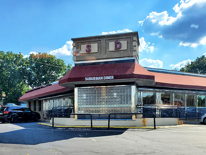 The iconic Suburban Diner sign stands proud along Bustleton Pike, promising "BAKING ON PREMISES" – a siren song for carb enthusiasts everywhere.