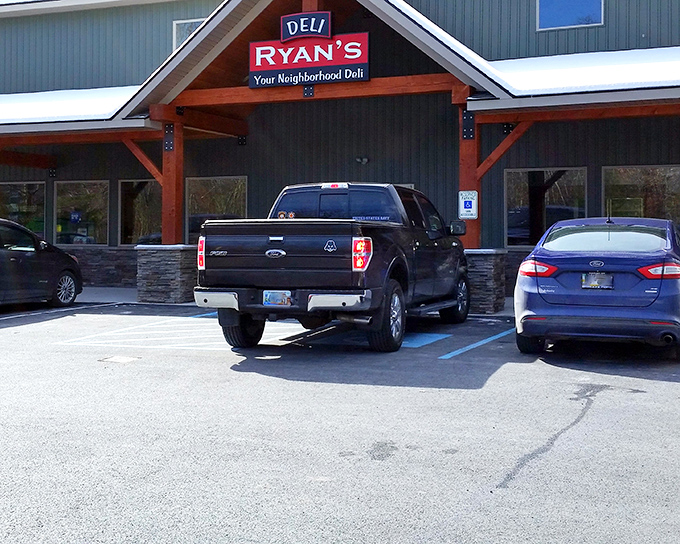 Ryan's Deli welcomes hungry travelers with its rustic wooden beams and stone accents—proof that architectural modesty often hides culinary magnificence.