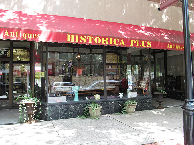 That cheerful red awning beckons like a beacon for treasure hunters seeking Pennsylvania's finest antique discoveries.
