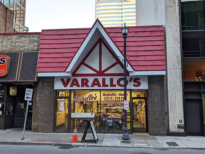 The iconic red-roofed Varallo's stands like a time capsule amid downtown Nashville's modern skyline—a culinary landmark that's outlasted countless music trends.