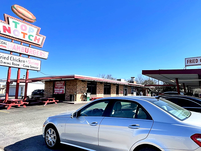 That iconic neon sign has been beckoning hungry Austinites since 1971—a beacon of burger bliss on Burnet Road that promises time travel with every visit.