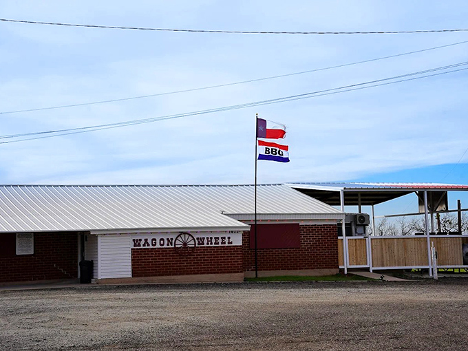 The unassuming exterior of Wagon Wheel Dance Hall stands like a culinary speakeasy—only those in the know realize what smoky treasures await inside.
