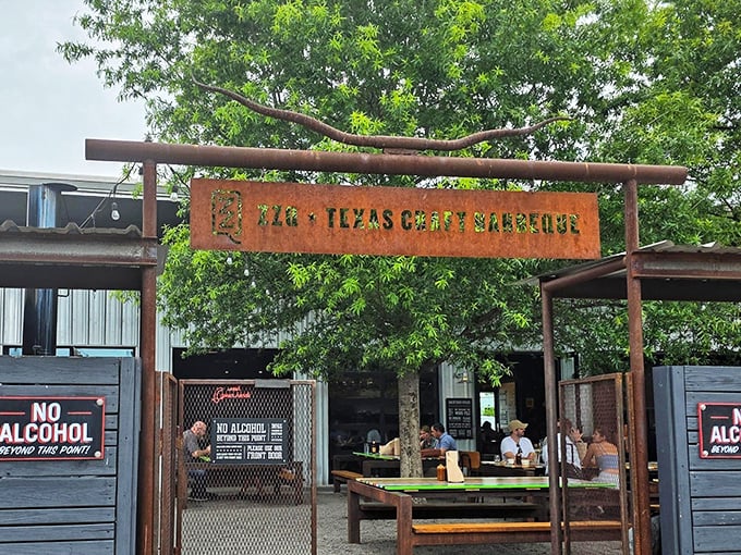 The rusted metal archway entrance to ZZQ sets the tone immediately – this isn't just dinner, it's a pilgrimage to meat paradise.