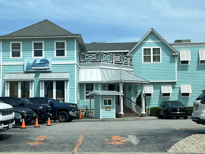 The aqua-colored exterior of Waterman's stands like a coastal beacon, promising seafood treasures within its unassuming beach house façade.
