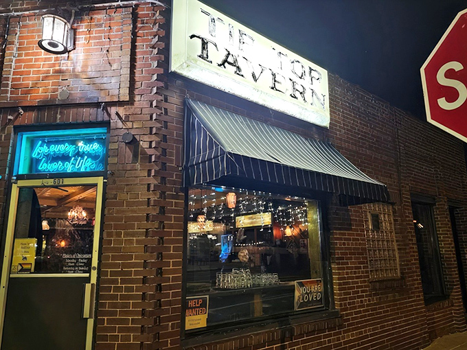The unassuming brick exterior of Tip Top Tavern stands like a culinary sentinel at the corner, promising delights that belie its modest appearance.