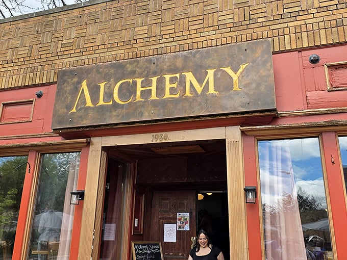 The weathered brick and golden "ALCHEMY" sign aren't just a storefront—they're a promise of culinary magic waiting inside this Madison gem.