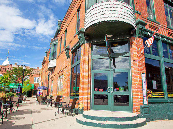 The historic brick building with its distinctive copper dome stands proudly on the corner, like a Victorian gentleman who secretly makes the best barbecue in town.