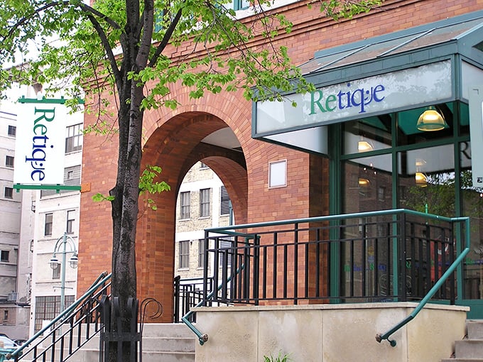 The distinctive brick façade and green trim of Retique welcomes bargain hunters like a fashionable friend who knows all the best secrets.