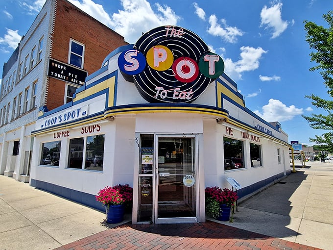The retro façade of The Spot stands like a time machine on Sidney's corner, its colorful vintage sign promising comfort food salvation to hungry travelers.