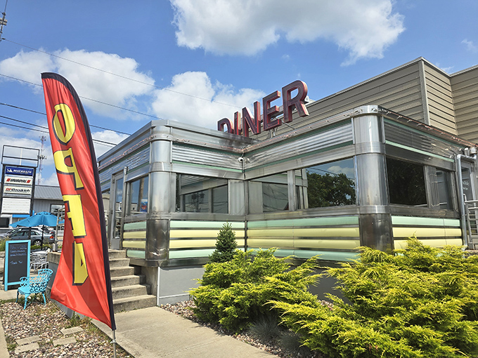 The classic stainless steel exterior of Broadway Diner gleams like a beacon of breakfast hope. This isn't retro by design—it's the real deal that never went out of style.