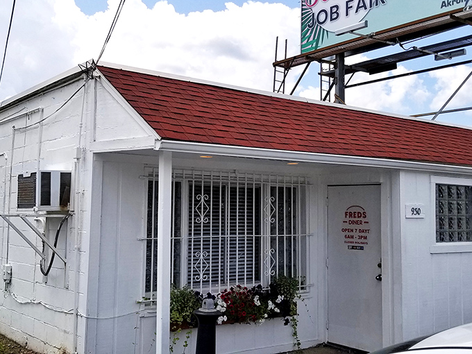 The unassuming white exterior of Fred's Diner stands like a culinary time capsule, promising authentic flavors that no fancy façade could ever improve upon.
