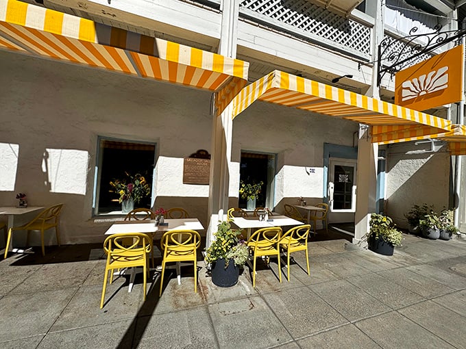 Those cheerful yellow awnings aren't just for show—they're like California sunshine in architectural form, beckoning you to slow down and savor Sonoma's flavors.