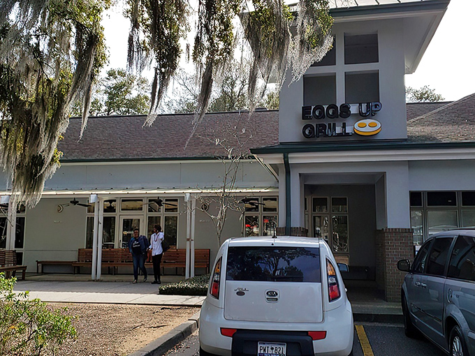 The inviting exterior of Eggs Up Grill beckons with its cheerful sign and welcoming porch – like a breakfast lighthouse guiding hungry souls to shore.