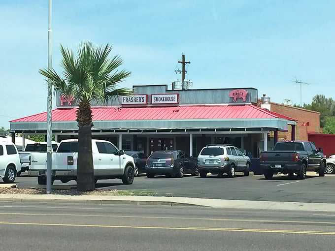 Frasher's unassuming exterior might fool you, but that red roof and palm tree combo is like a beacon for BBQ pilgrims seeking smoky salvation.