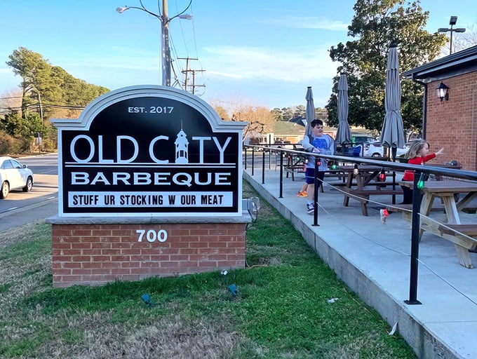 The sign says it all: "STUFF UR STOCKING W OUR MEAT." In Williamsburg, Old City Barbeque doesn't just serve food—it serves personality with a side of humor.
