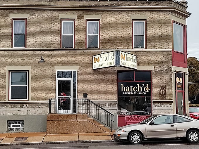 The corner brick building with its red accents practically winks at you – hatch'd STL stands ready to transform your morning from mundane to magnificent.