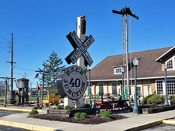 That railroad crossing sign isn't just decoration – it's your first hint that culinary magic awaits inside.
