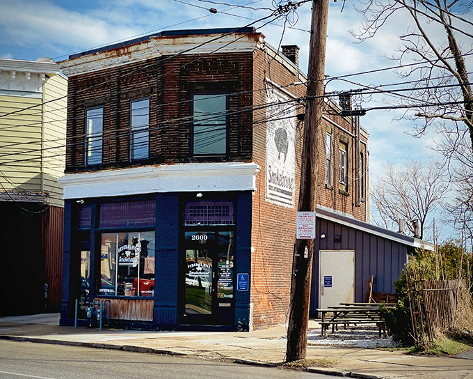 The writing's on the wall—literally! Federal Hill Smokehouse's rustic brick exterior proudly displays its mission with a simple pig silhouette that promises smoky delights within.