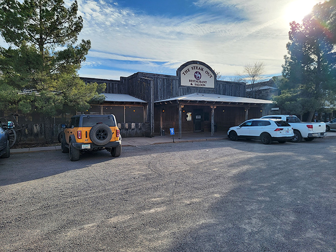 The Western movie set of your dreams isn't in Hollywood—it's in Sonoita, where The Steak Out's weathered wooden facade promises authentic cowboy cuisine.