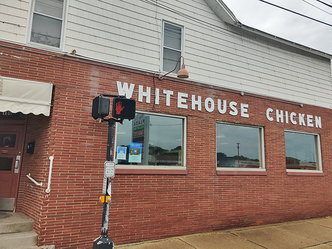 The unassuming brick exterior of White House Chicken holds no pretense – just the promise of Barberton's finest poultry legacy waiting inside that humble doorway.