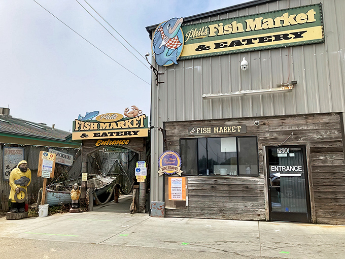 The unassuming exterior of Phil's Fish Market & Eatery stands like a seafood speakeasy – no fancy frills, just the promise of oceanic treasures within those weathered wooden walls.