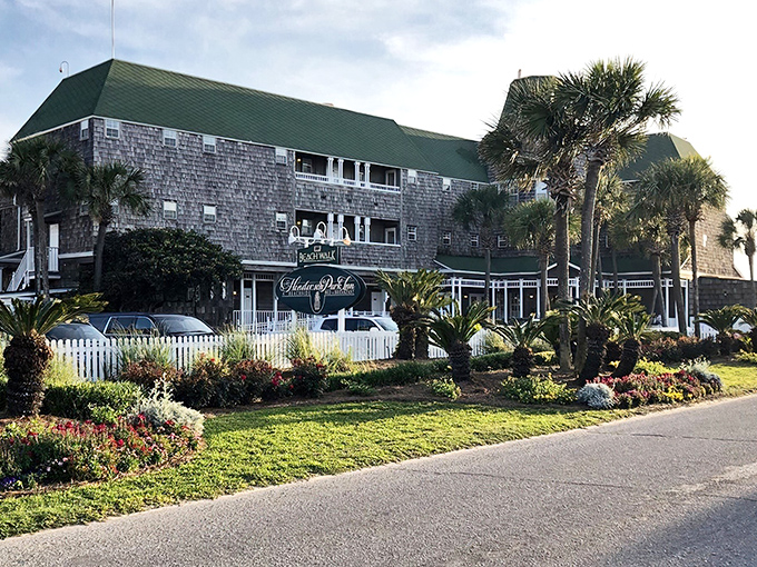 The stone facade of Beach Walk Cafe stands like a coastal castle, palm trees standing guard over this culinary treasure nestled in Destin's sugar-white shores.