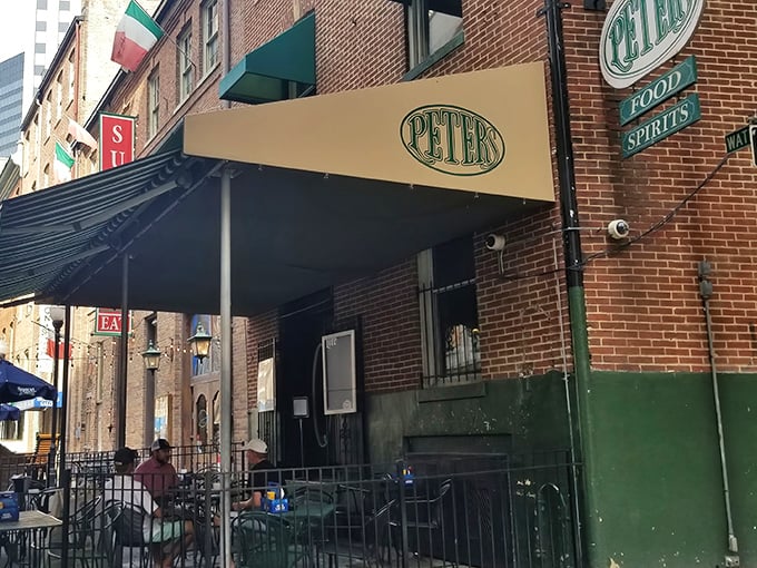 The unassuming brick facade of Peter's Pour House stands like a culinary speakeasy, promising treasures for those in the know. 