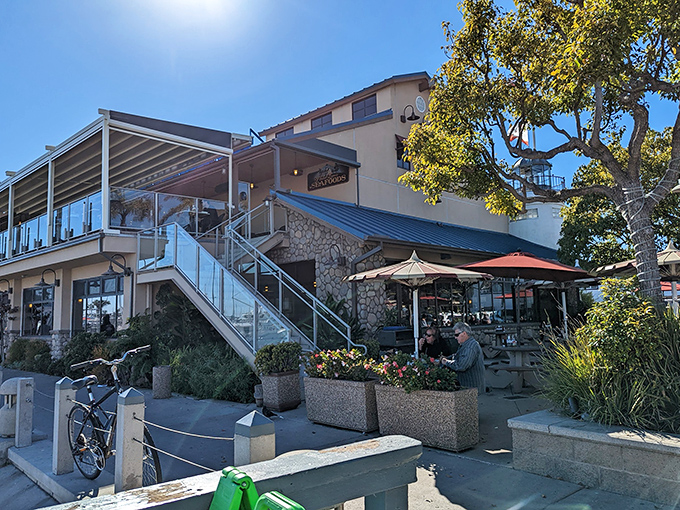 The lighthouse-shaped entrance isn't just architectural whimsy—it's a beacon calling seafood lovers home to Point Loma Seafoods in San Diego.