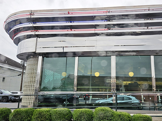 The neon-trimmed exterior of Metro 29 Diner glows like a beacon of hope for the hungry, a chrome-clad time machine promising comfort food salvation.
