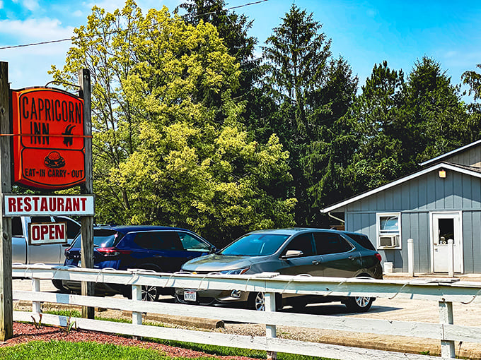 The unassuming blue exterior of Capricorn Inn stands like a culinary speakeasy, hiding delicious secrets behind its modest façade.