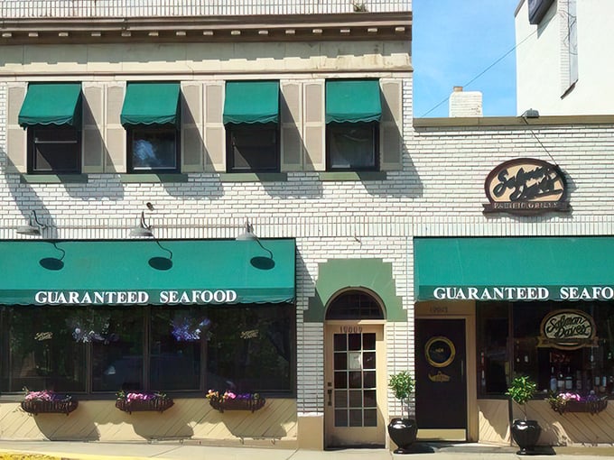 The distinctive navy blue awning signals your arrival at coastal paradise, even in landlocked Ohio. Those flower baskets aren't just pretty—they're your first hint of the attention to detail waiting inside.