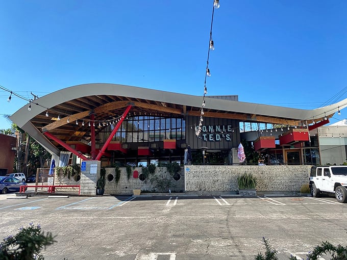 The wave-like roof and bold red supports of Connie and Ted's aren't just architectural showmanship—they're a siren call to seafood lovers across Los Angeles.