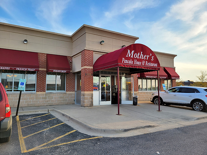 The unassuming storefront of Mother's Pancake House beckons like a breakfast lighthouse in Aurora's strip mall sea. Comfort awaits inside.