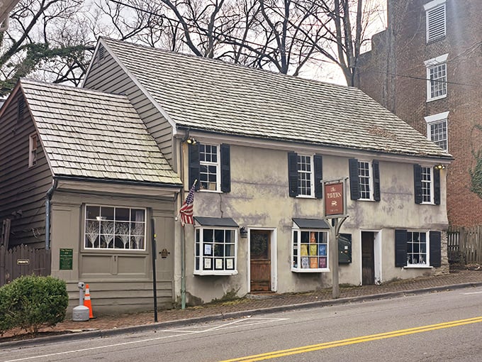 History doesn't just whisper here—it practically pulls up a chair. The Tavern's weathered exterior stands as a colonial time capsule on Abingdon's historic streets.