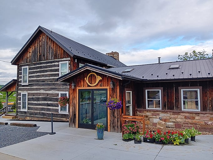 This isn't just a restaurant, it's a time machine. Horn O Plenty's log cabin exterior blends pioneer charm with modern hospitality, complete with colorful flower baskets that practically sing "welcome."