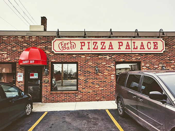 The brick fortress of flavor stands ready, promising pasta perfection behind that unassuming "Pizza Palace" sign.