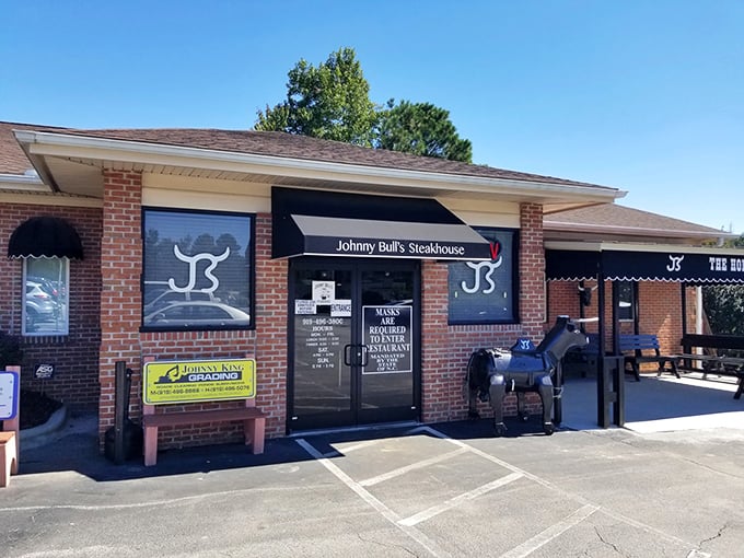The unassuming brick exterior hides culinary greatness like Clark Kent's glasses hide Superman. That metal bull knows what's up.
