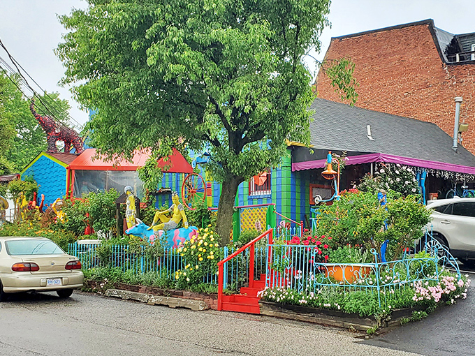 The exterior of PaperMoon Diner looks like a toy store had a beautiful collision with a paint factory. Mannequins and vibrant colors announce: normal dining, this is not.